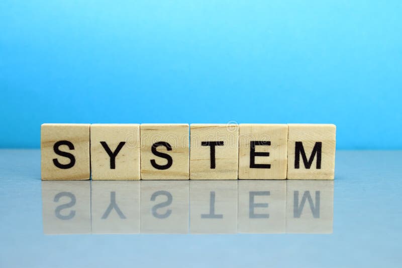 System Word Made of Wooden Blocks on a Blue Background Stock Photo ...