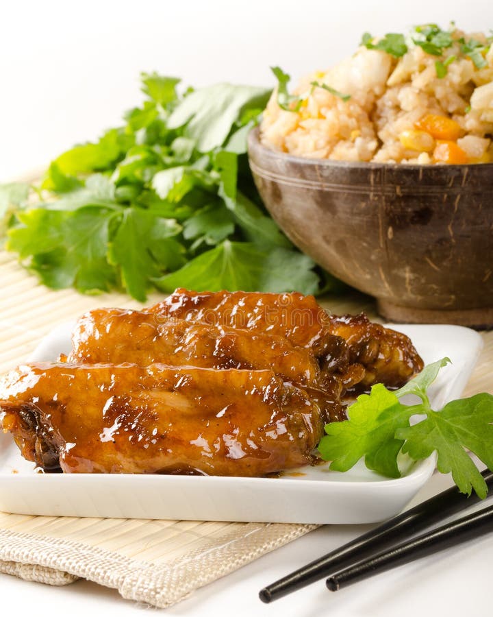 Szechuan Chicken Wings with Fried Rice Stock Image - Image of parsley ...