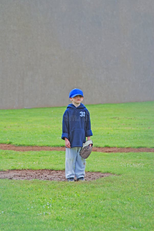 T-Ball Player Standing in the Rain Stock Photo - Image of happy ...