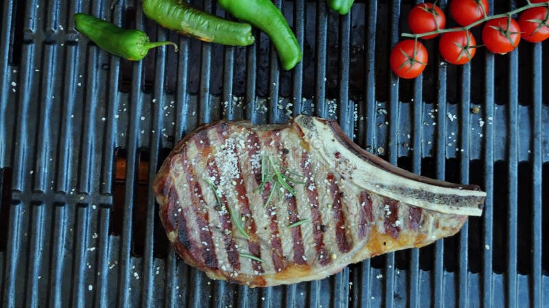 T Bone Beef Steak on Barbecue Grill Grate, Flame. Top View Stock Video ...