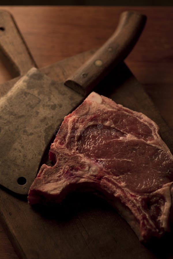 T-bone Roast Beef Steak with a Vintage Cleaver on a Cutting Boar Stock ...