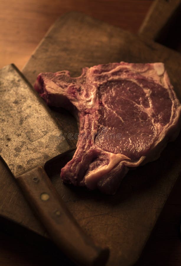 T-bone Roast Beef Steak with a Vintage Cleaver on a Cutting Boar Stock ...