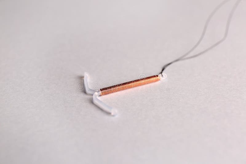 T Shaped Intrauterine Birth Control Device On Light Background Stock