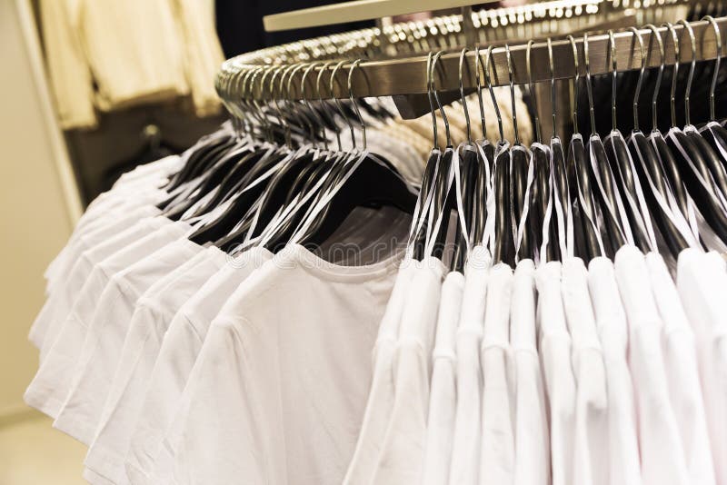 T-shirts Hanging on Rack in a Store Stock Image - Image of fashion ...