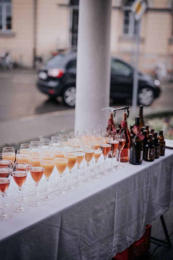 Table with an Array of Refreshments and Bottles of Alcohol Outdoors ...