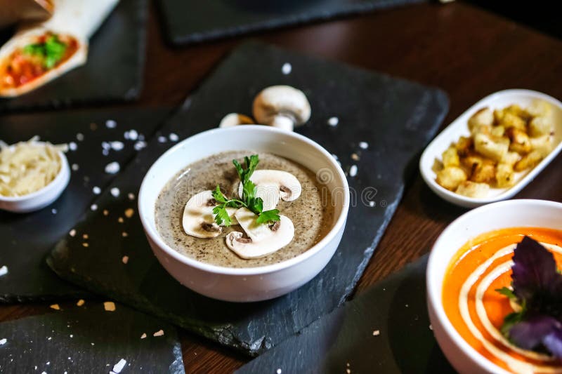 Table with Assorted Bowls of Food and Soup Stock Image - Image of ...