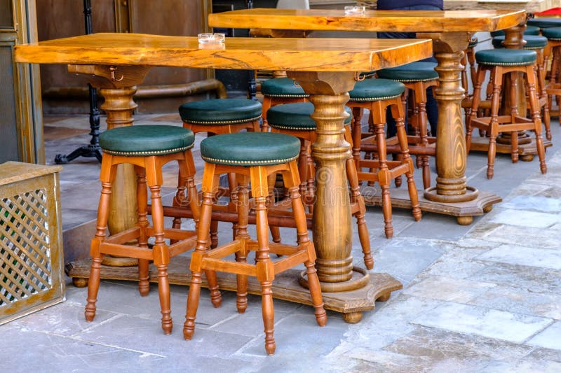 Table and bar stools. stock image. Image of comfortable - 165601843