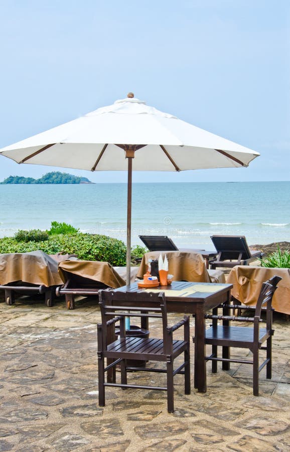 Table on the beach stock photo. Image of chair, table - 27251506