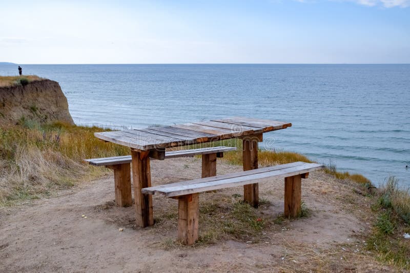Table and Benches by the Sea. a Place To Sit and Relax Stock Photo ...