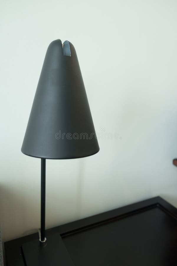 Table lamp is on the table stock image. Image of business - 114295707