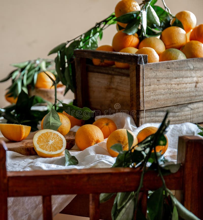 Table with Box of Fresh Orange with Orange Tree Branch and Fresh Orange ...