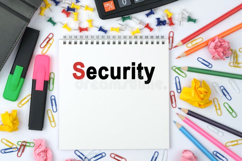 On the Table are Markers, Paper Clips and a Notebook with the ...