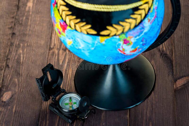 Cap of the Ship Captain and Next To it Lies a Compass Stock Image ...