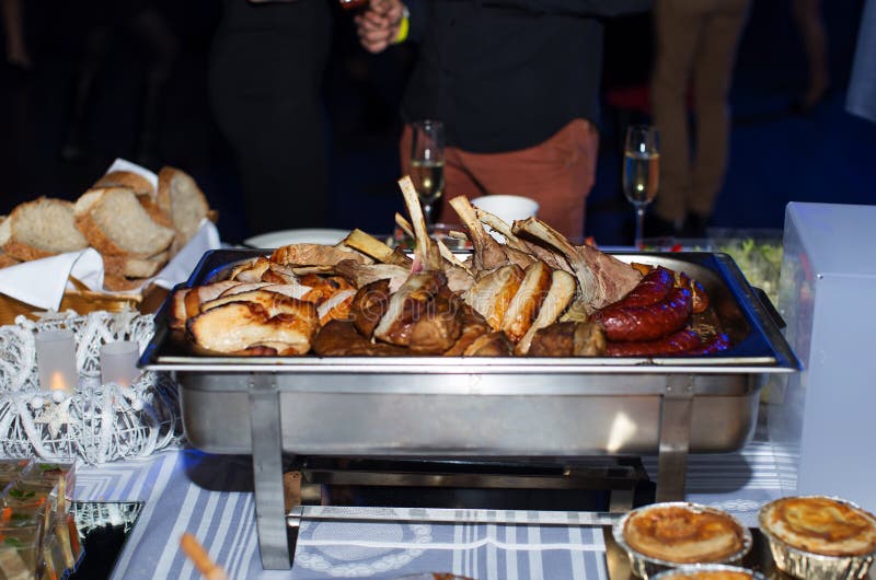 Table with chafing dish stock photo. Image of steel, hand - 64279676