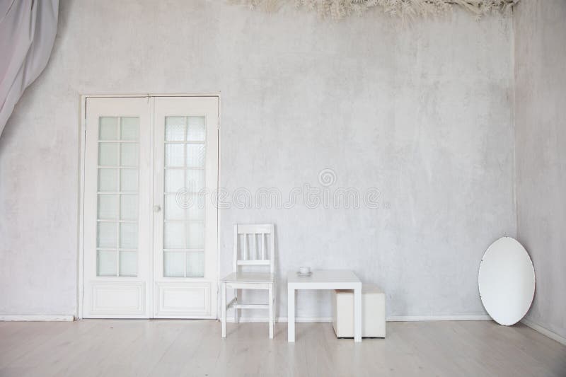 Table, Chair and Mirror in the Interior of an Empty White Room Stock ...