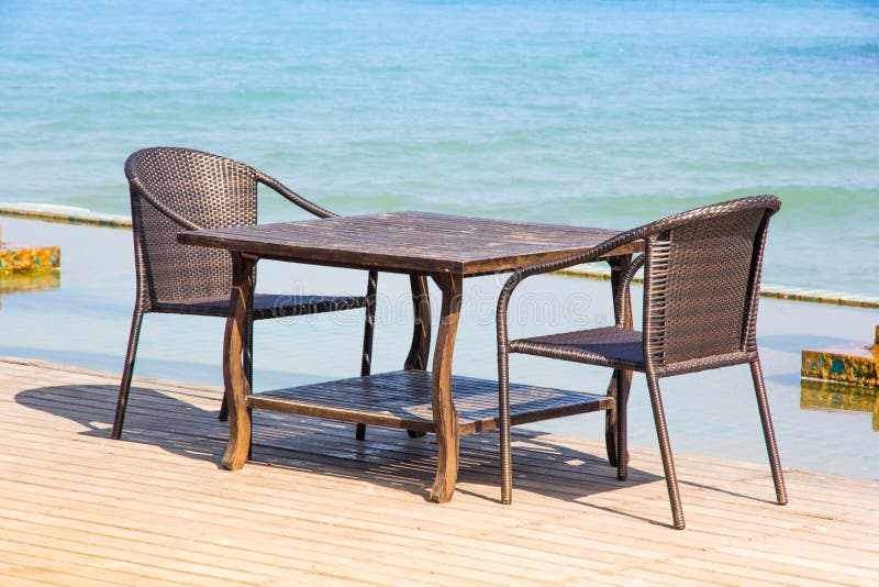 Table chair beside sea stock image. Image of nature, scenic - 40251673