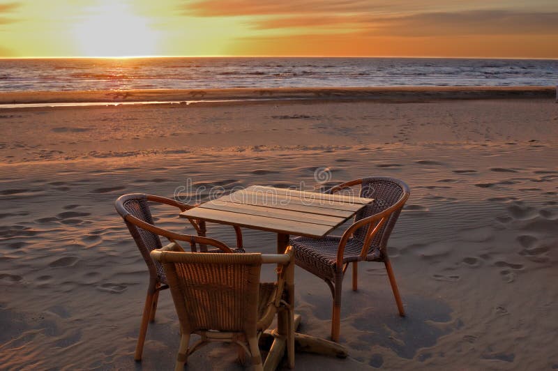 Table and Chairs in Cafe on the Beach at Sunset Stock Image - Image of ...