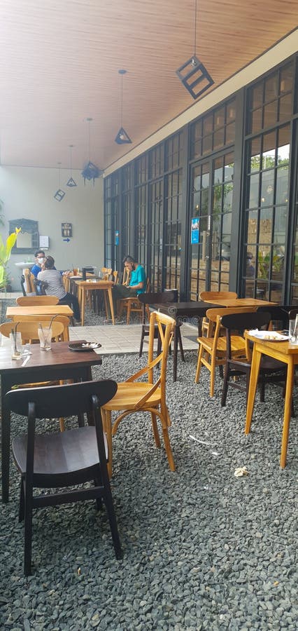 A Table and Chairs in a Coffee Shop Made of Wood Stock Photo - Image of ...