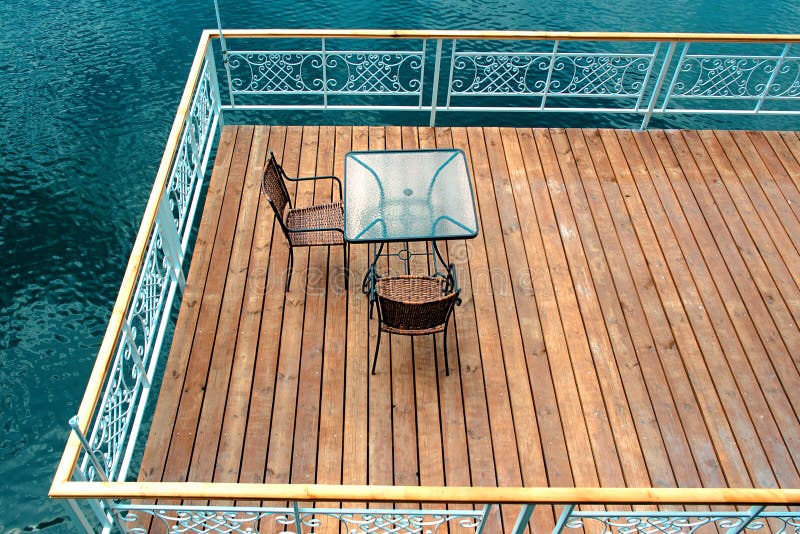 A Table and Chairs Near the Lake Stock Image - Image of dock, peaceful ...