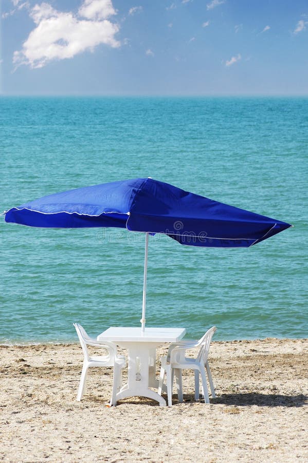 Table, chairs and parasol stock image. Image of climate - 2657525
