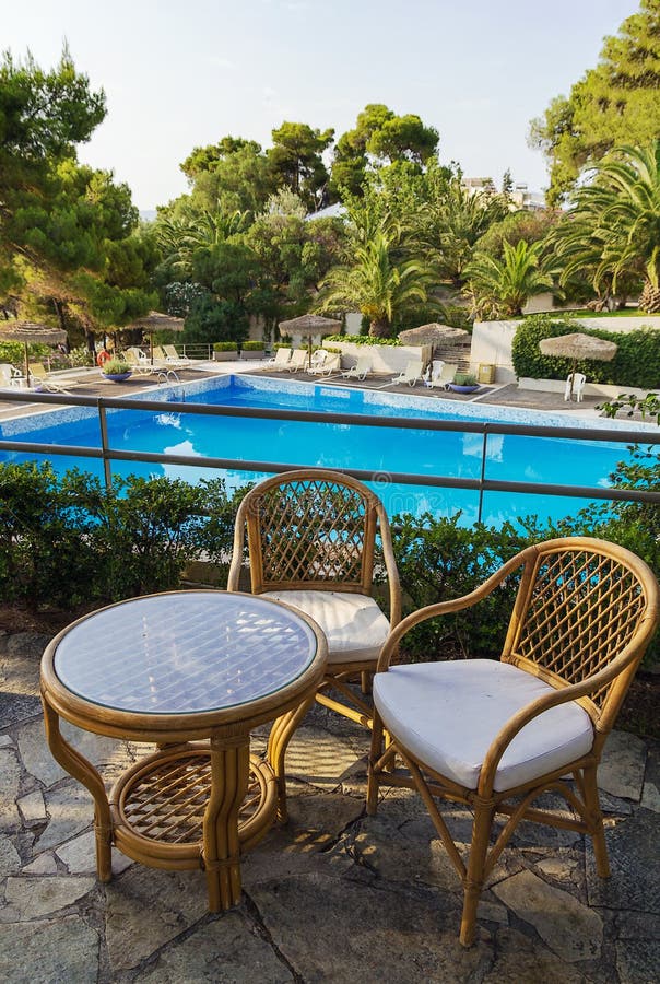 Table and Chairs for Rest Overlooking the Pool Stock Photo - Image of ...