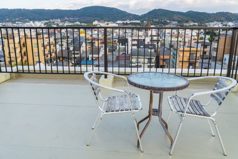 Table and Chairs on Roof Top Terrace Exterior . Stock Photo - Image of ...
