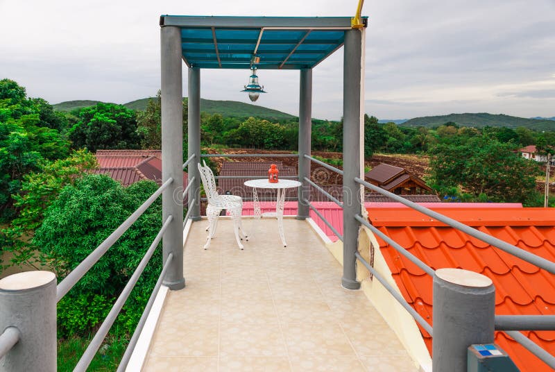 Table and Chairs on Rooftop Stock Photo - Image of rooftop, dinner ...