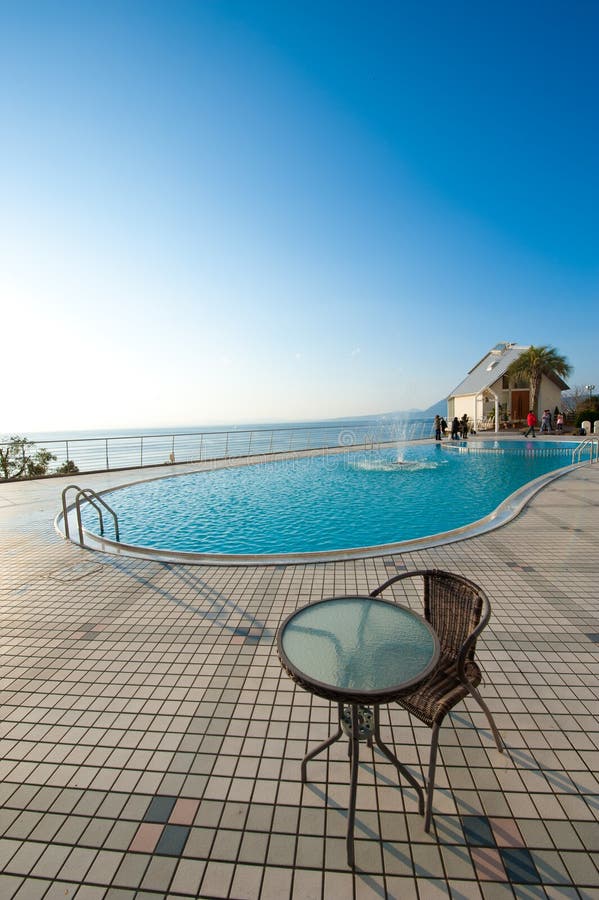 Table and Chairs with Sunrise Stock Image - Image of dinner, resort ...