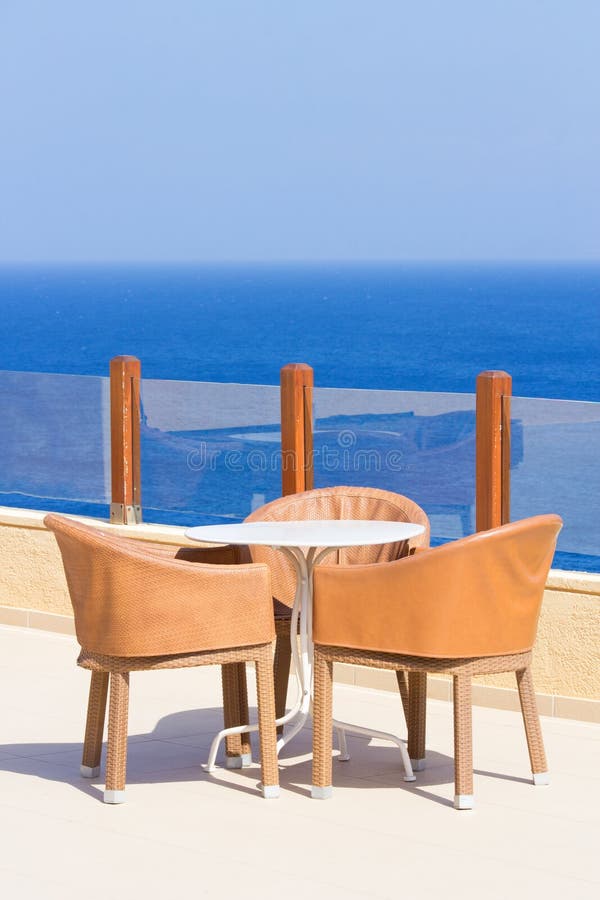Table and Chairs on Terrace with Sea View Stock Photo - Image of ...