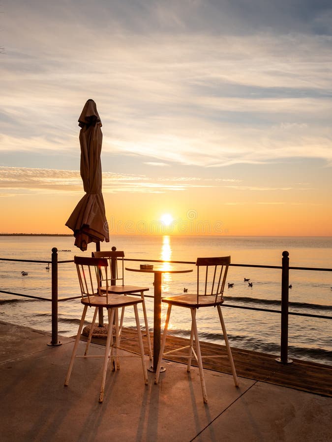 Table, Chairs and Umbrella on a Terrace, by the Beach Stock Image ...