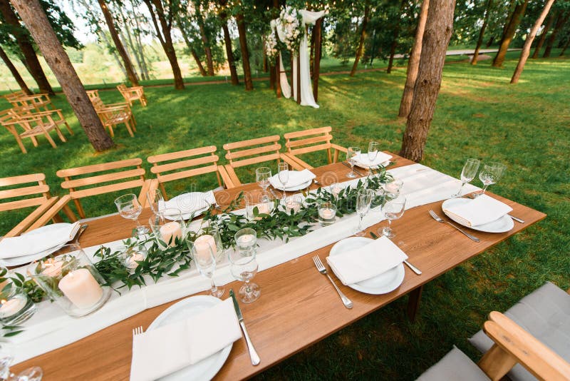 Table, Chairs and Wedding Decoration in the Forest. Green Rustic Decor ...