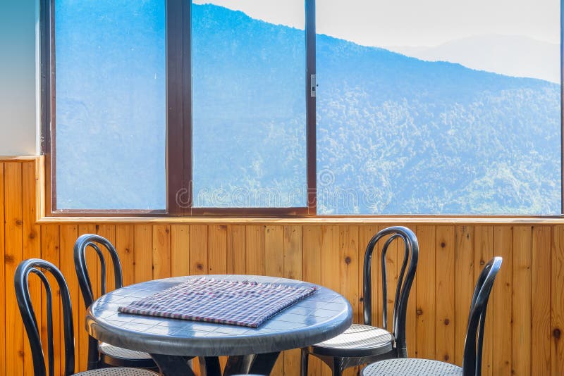 Table, Chairs and Window with View of Mountain Outside. Stock Photo ...