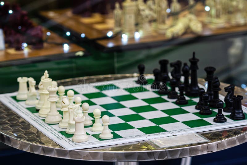 A Table with a Chess Board and Figures on the Side of the Street at a ...