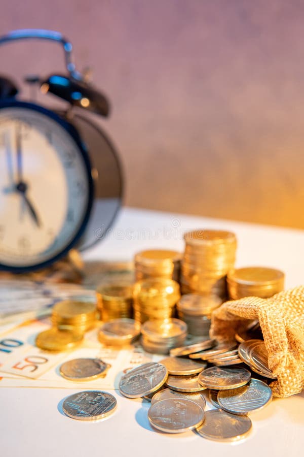 Clock and Coin Stack on Table. Time Investment Stock Image - Image of ...