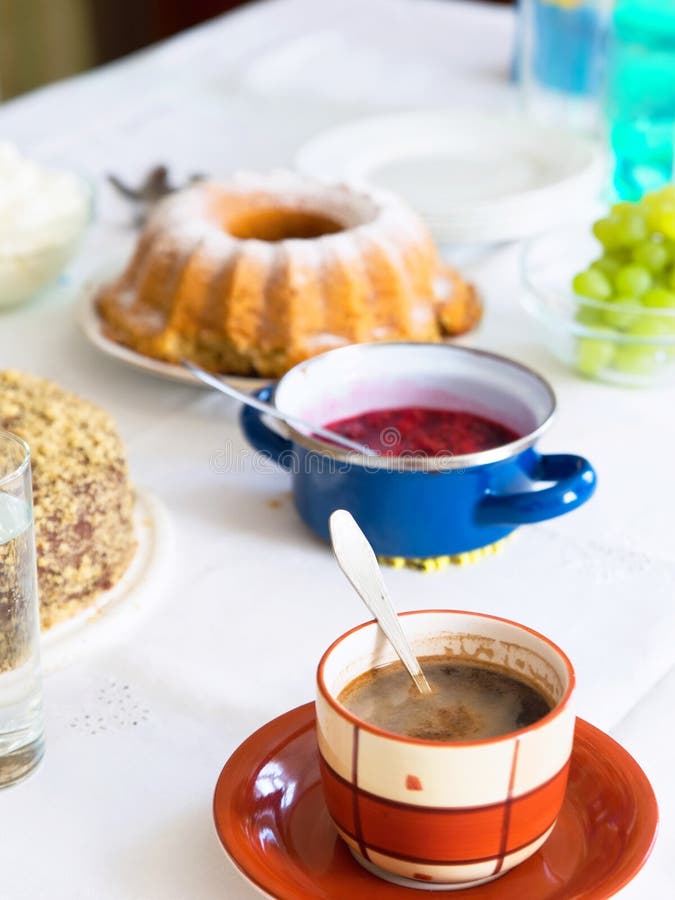 Table with Coffe,cake,grape and Raspberry Sauce Stock Photo - Image of ...