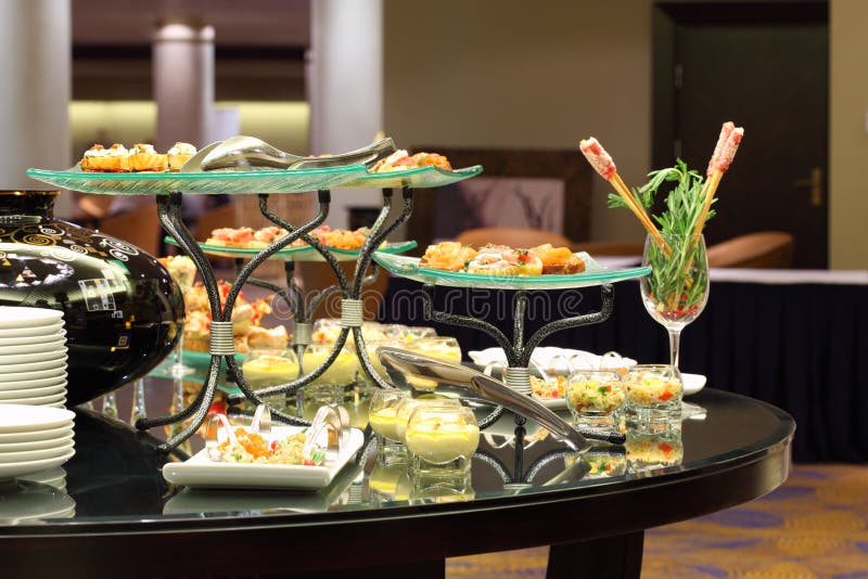 Table with Cold Snacks on Stand and Tableware Stock Image - Image of ...