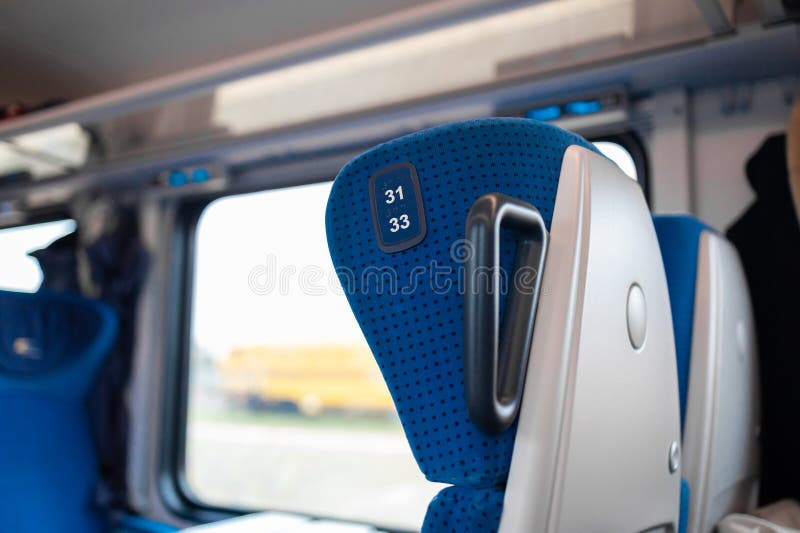 Table and Comfortable Leather Seats by Window in Railroad Car. Interior ...