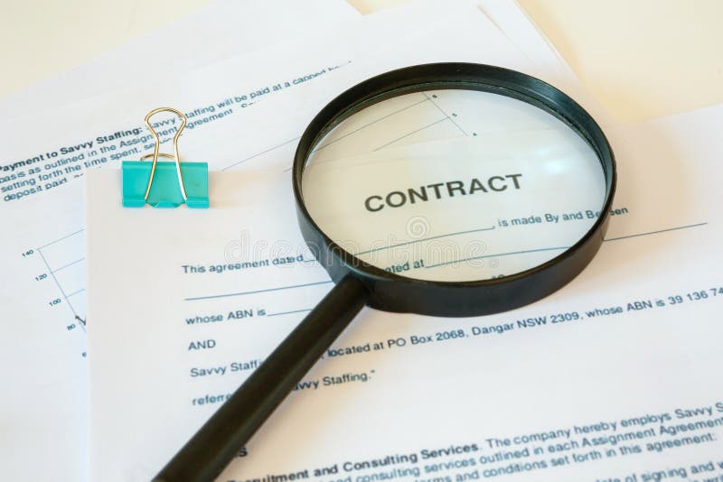 On the Table is a Contract Form and Magnifier Stock Photo - Image of ...