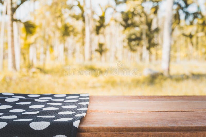 Table Covered with Tablecloth with Nature Background Stock Image ...