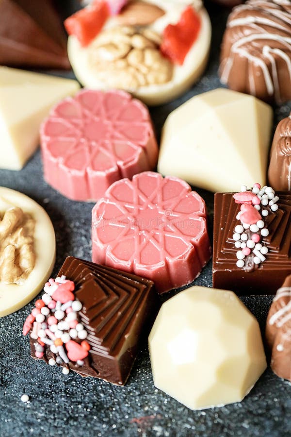Assorted Chocolates Adorn a Table Stock Photo - Image of chocolate ...