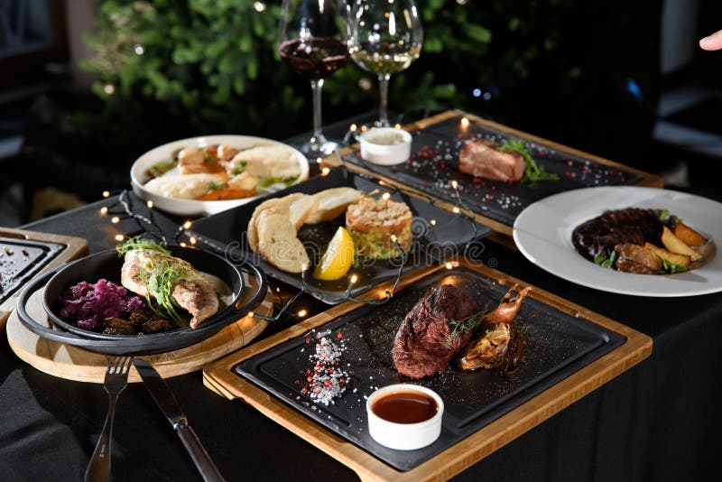 The Table is Covered with Various Meat Dishes. Delicious Dishes are ...