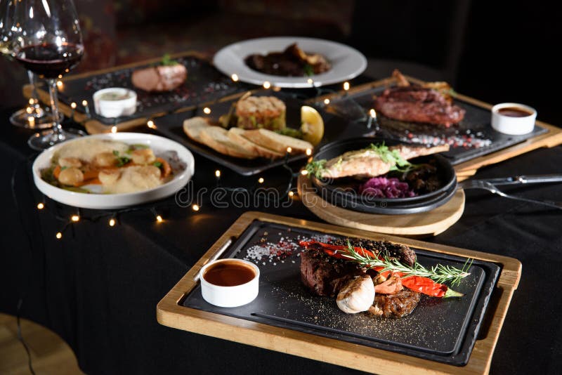 The Table is Covered with Various Meat Dishes. Delicious Dishes are ...