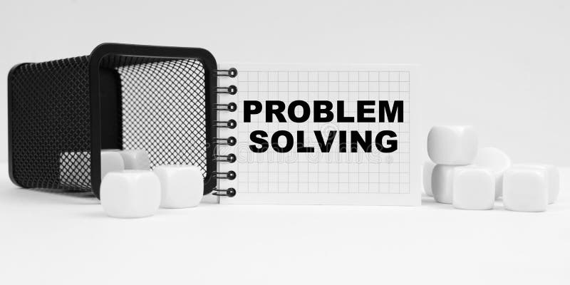 On the Table are Cubes, a Small Basket and a Notebook with the ...