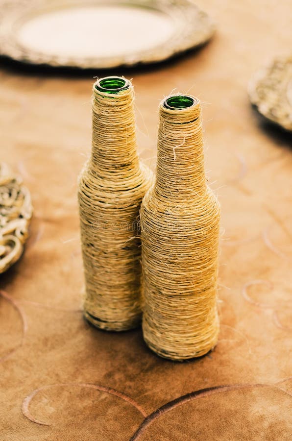 Table Decoration with Handcrafted Bottles Wrapped by Sisal Rope Stock ...