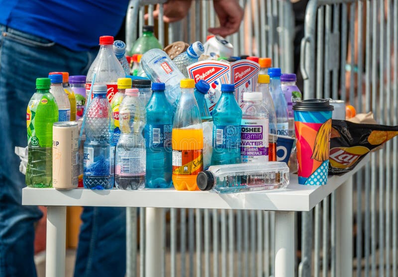 Table Filled with Many Plastic Bottles . Recycling and Plastic ...