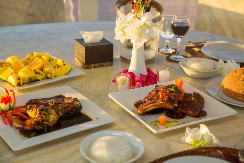Table with Food and Drink for Romantic Dinner on Sunset Stock Image ...