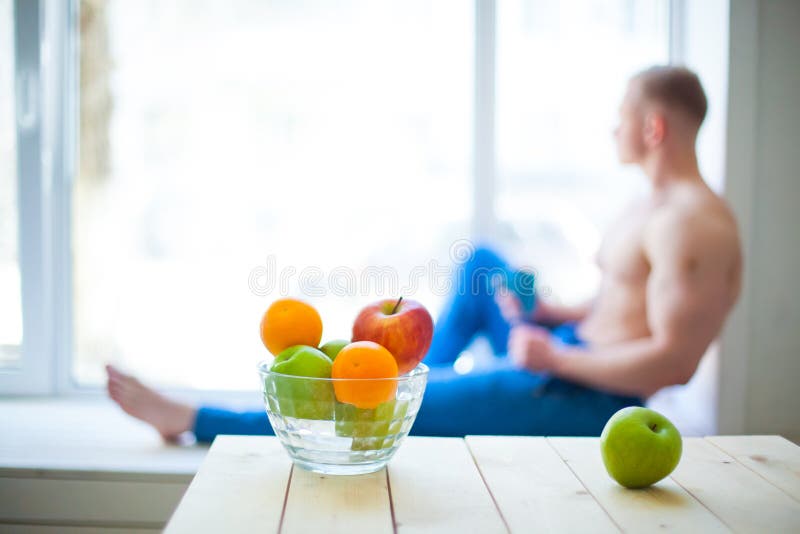 Table with Fruit, and in the Background is Out of Focus Young Pretty ...