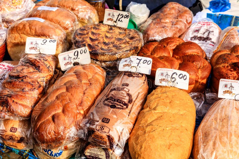 A Table Full of Breads with Prices on Them Stock Photo - Image of ...