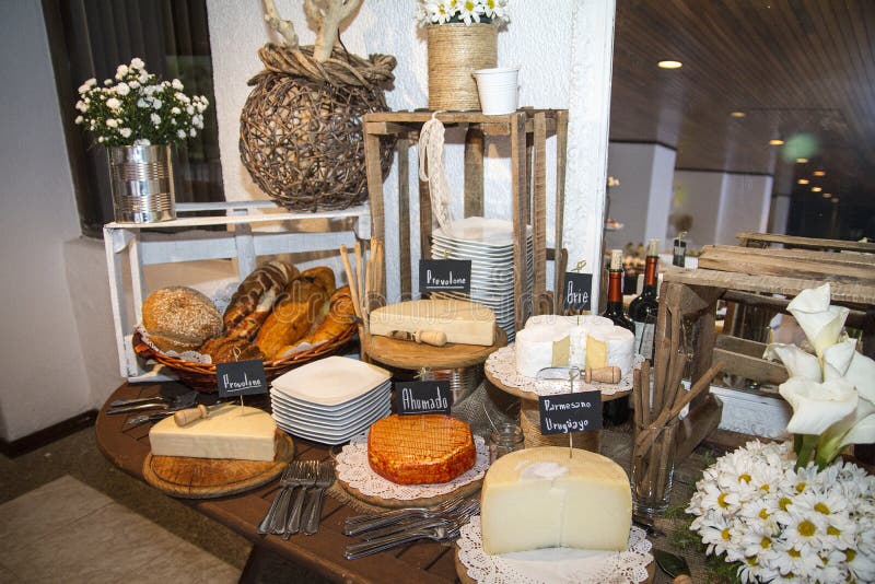 Table Full of Different Kinds of Cheese and Bread in a Shop Stock Image ...