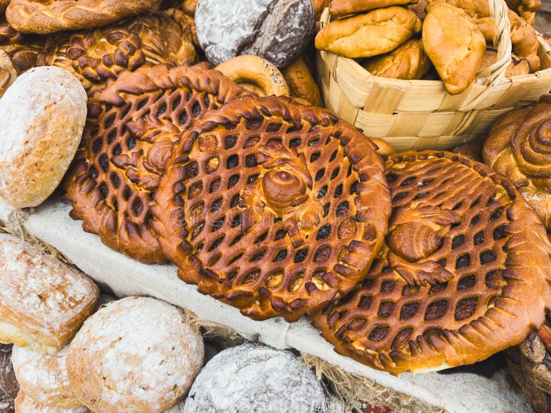 A Table Full of Different Types of Bread and Pastries Stock Image ...